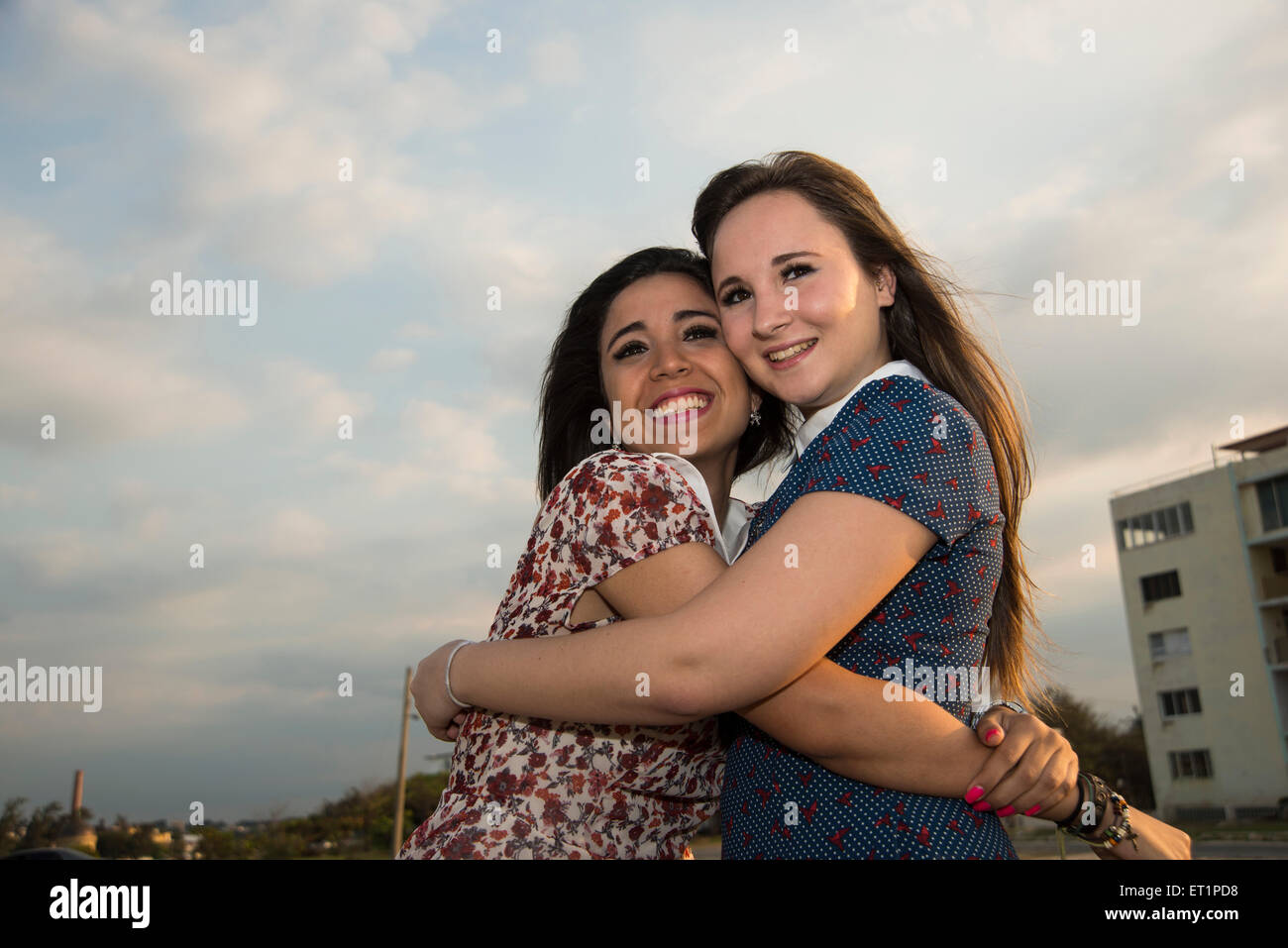 Two latina women hugging hi-res stock photography and images - Alamy