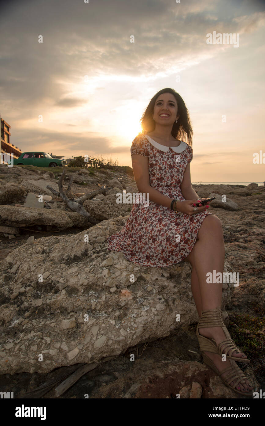 Young Latin woman enjoying the sunset Stock Photo - Alamy