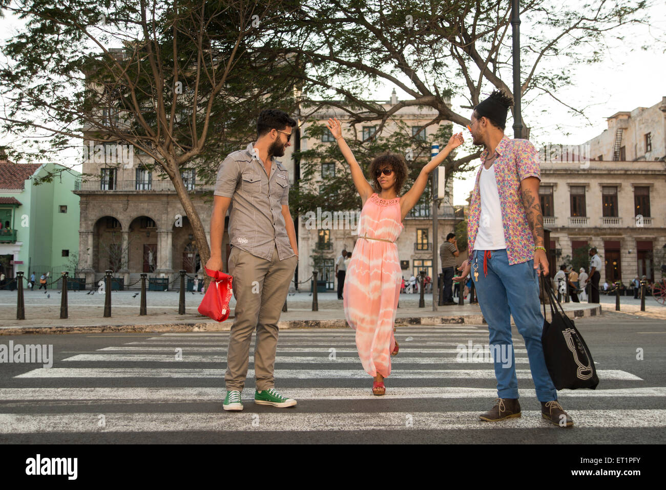 Three friends in the streets of Old Havana Stock Photo - Alamy