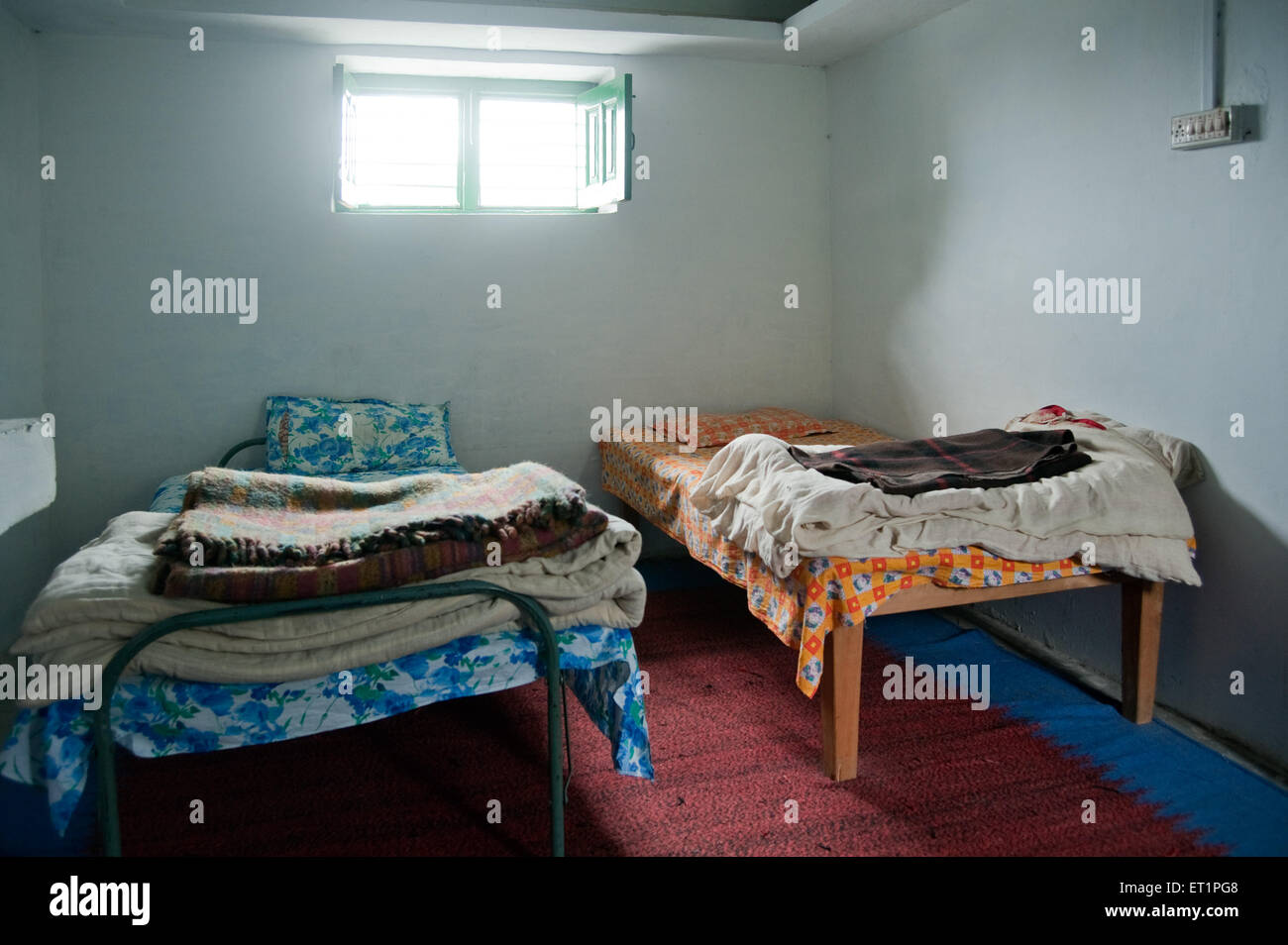 Bed in Rooms at narayan ashram pithoragar uttarakhand India Asia Stock ...