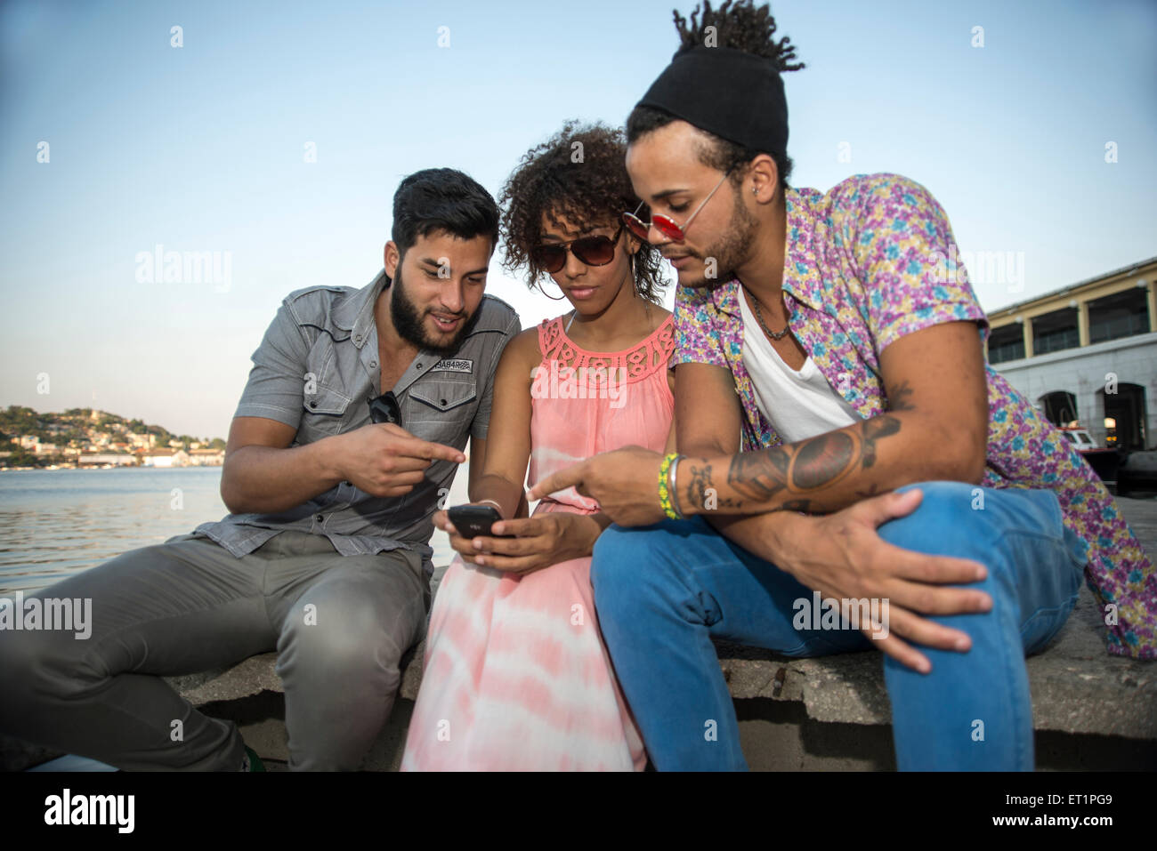 Three friends on the phone Stock Photo - Alamy