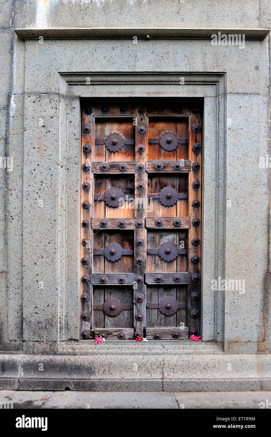 Decorated closed wooden door of hindu shiva temple at wai satara ...