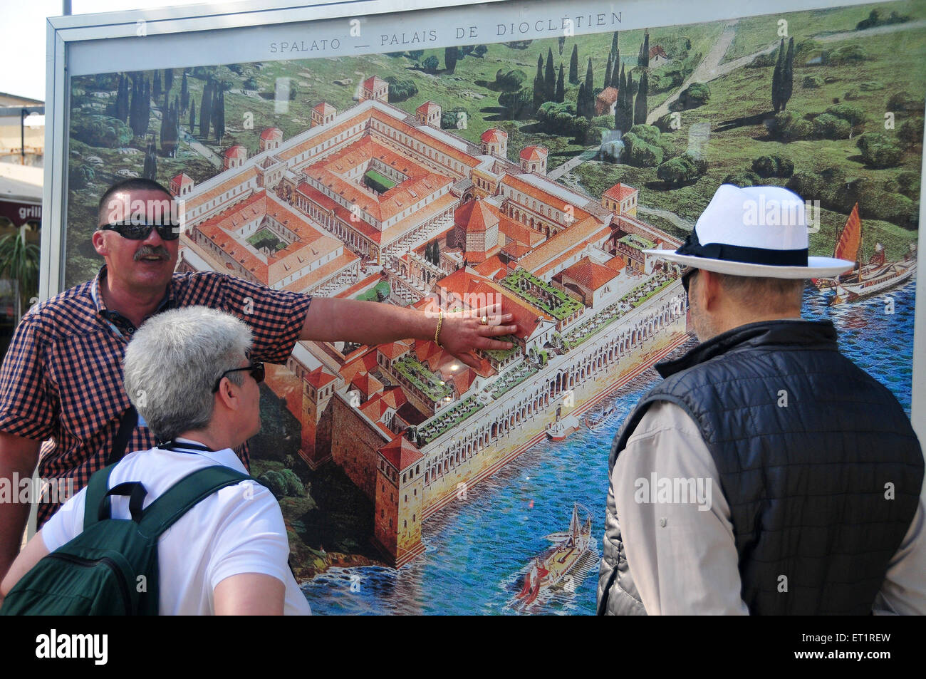 A guide in the old town of Split shows clients how the wall were built ...