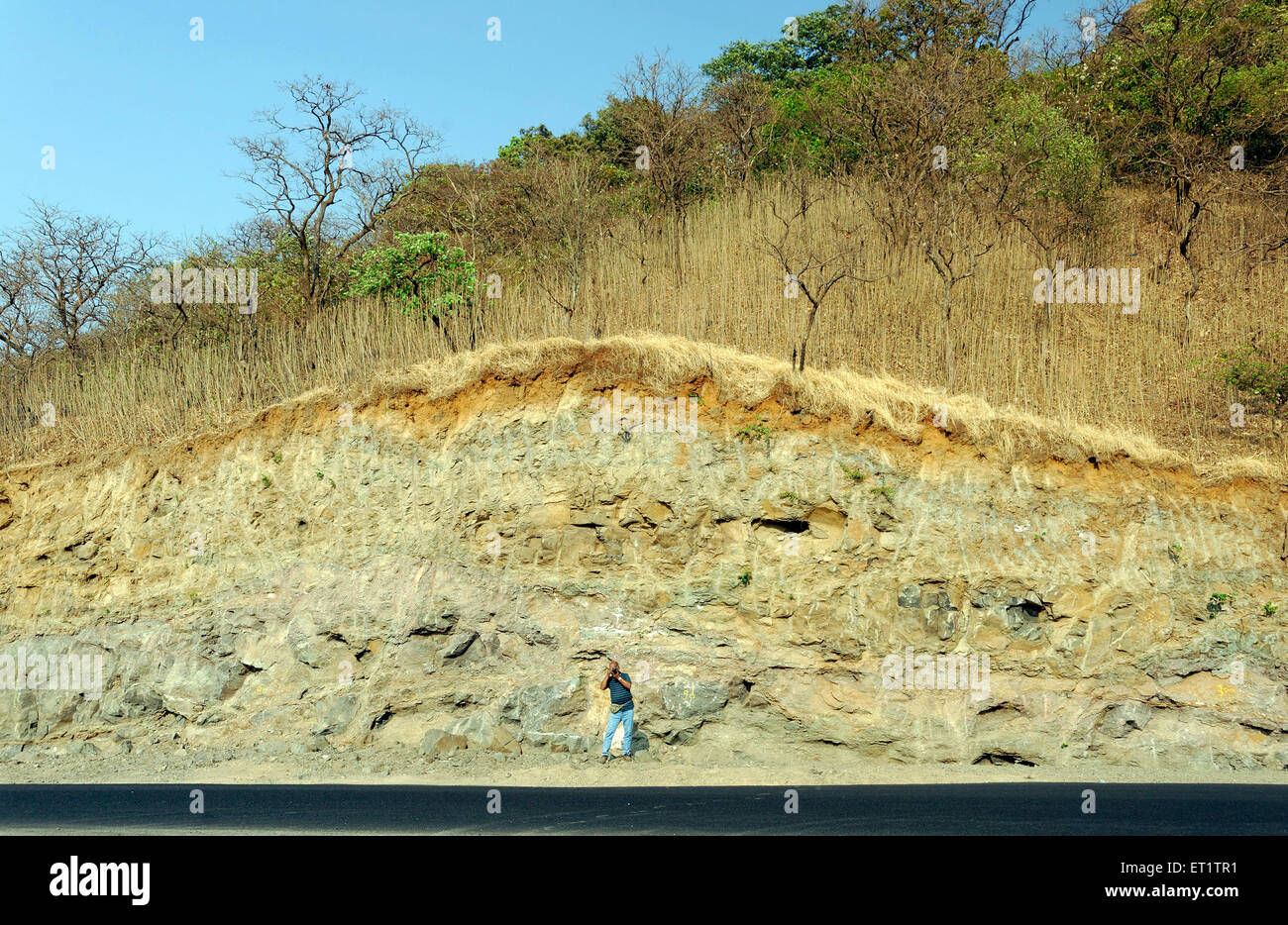 Photographer standing at mountain quarry Maharashtra India Asia MR#556 ...