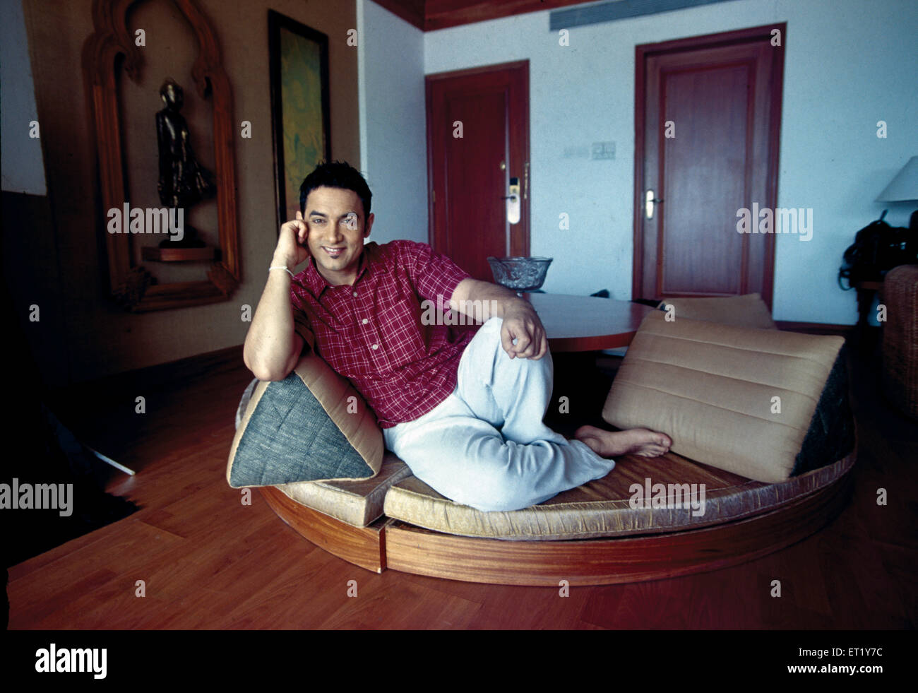 Indian man sofa hi-res stock photography and images - Alamy