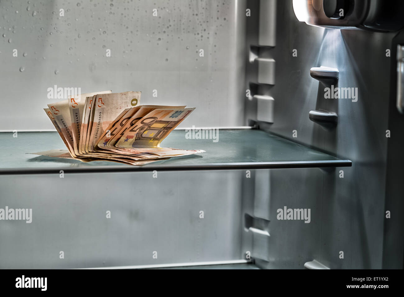 Fresh money in the refrigerator: a handful of 50 euros banknotes ...
