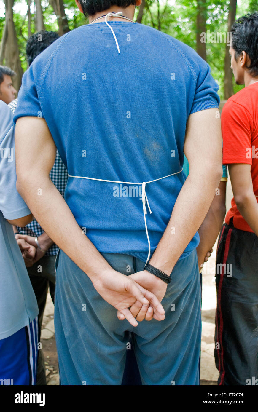 Man standing hands clasped behind hi-res stock photography and images ...