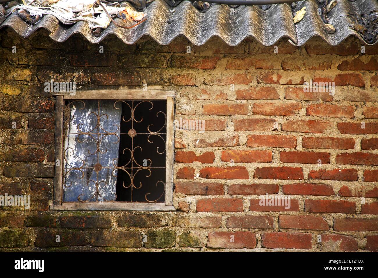 Brick wall and window in slum ; Koliwada ; Manori Marve marg ; Malad ...