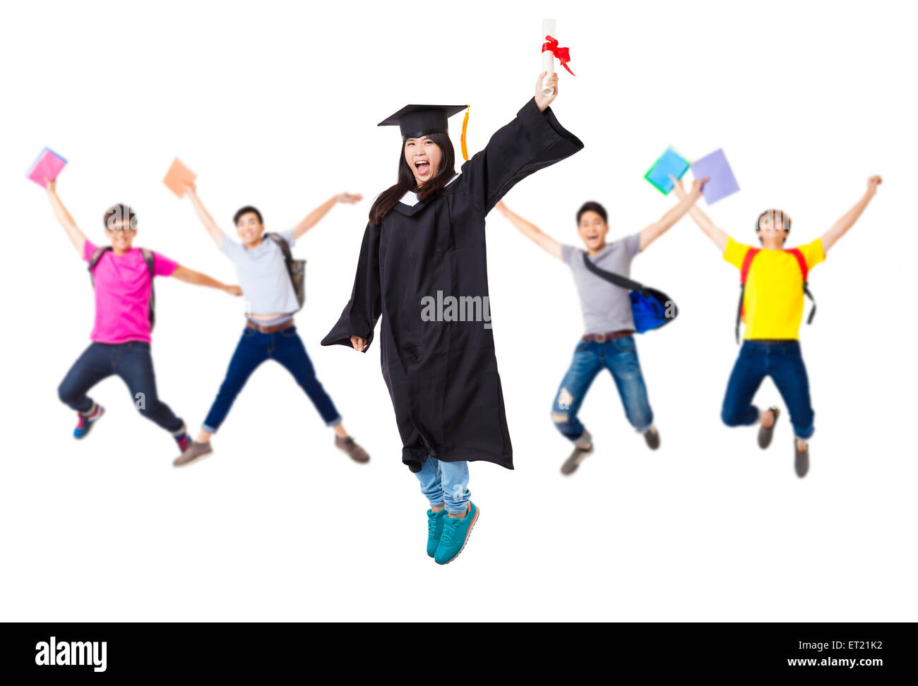 Happy student group in graduate robe jumping together Stock Photo - Alamy
