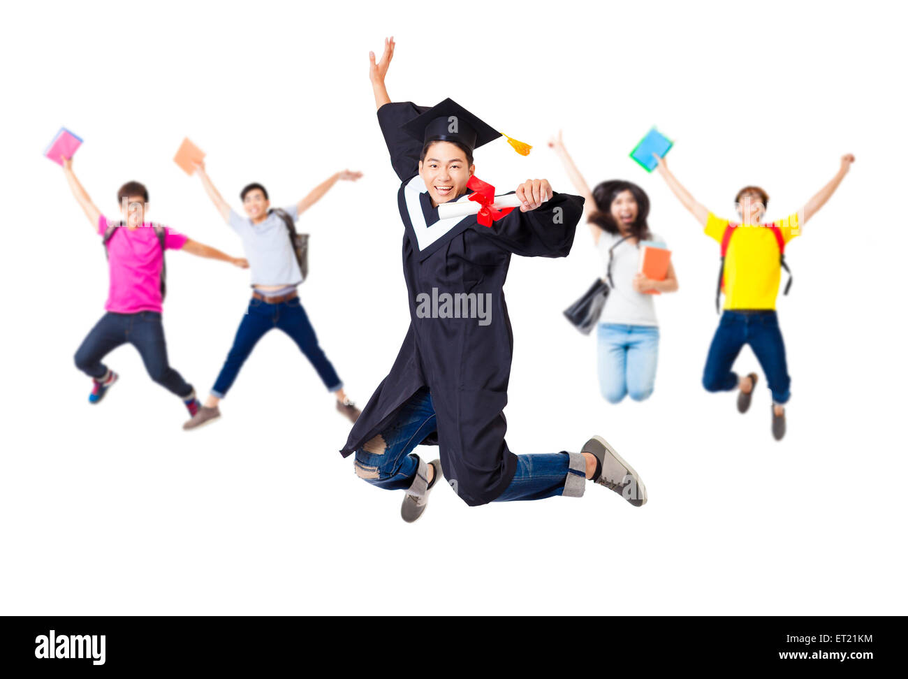 Happy student group in graduate robe jumping together Stock Photo - Alamy