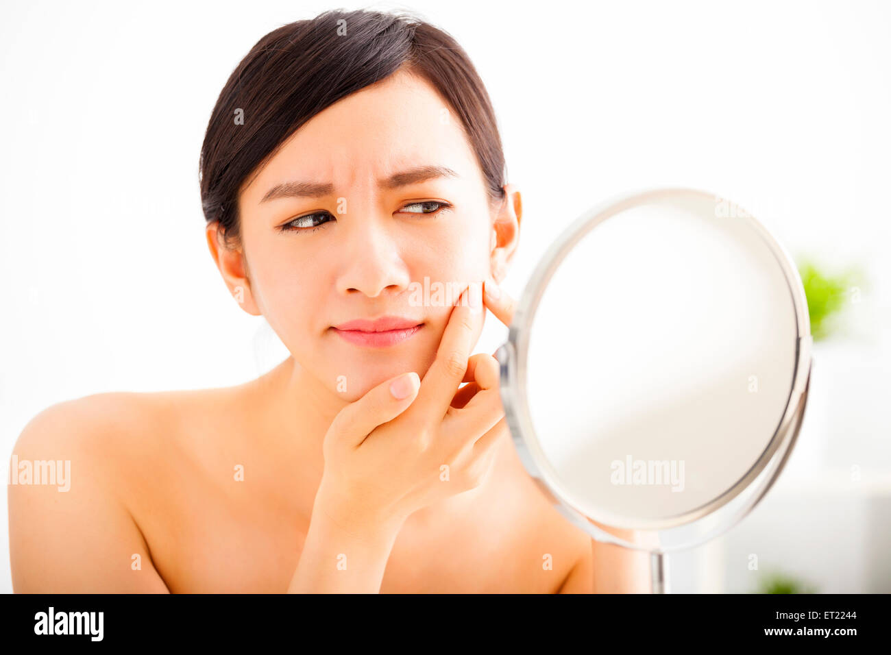 Squeezing acne hi-res stock photography and images - Alamy