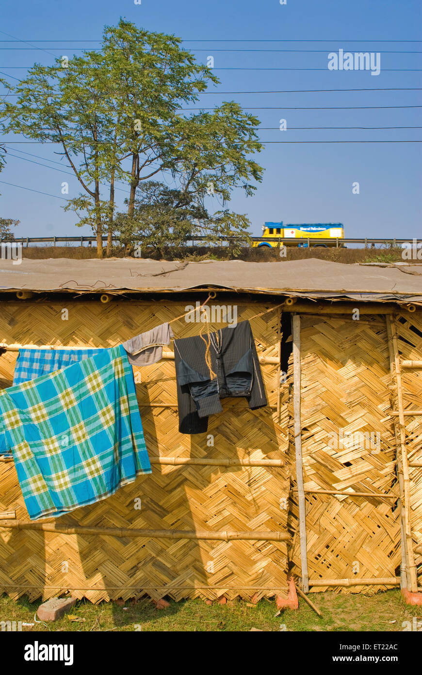 Clothes drying outside cane house, Asansol, Paschim Bardhaman district ...