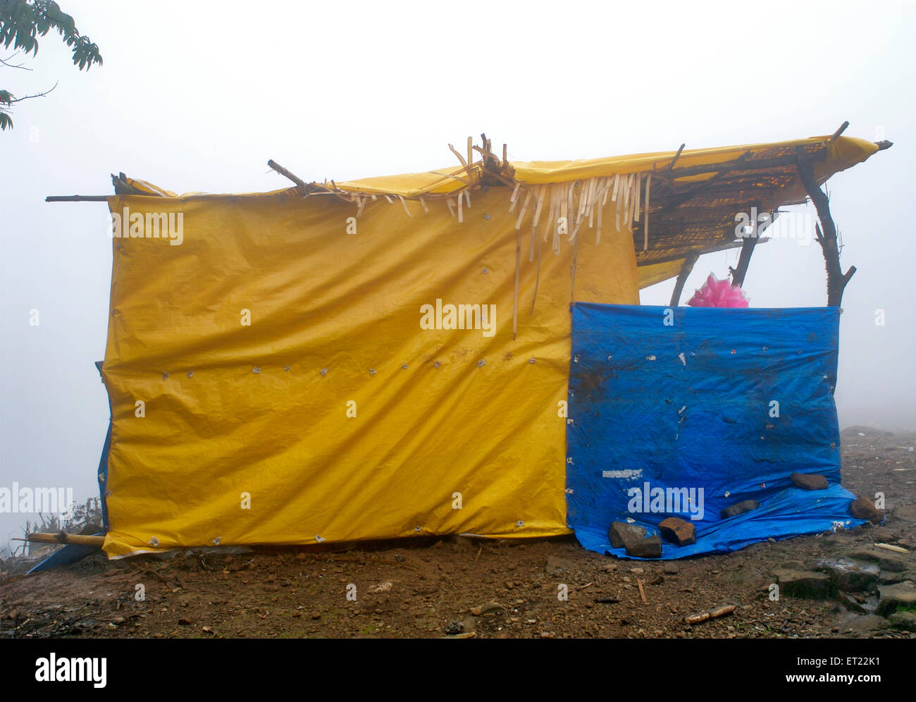 yellow and blue tarpaulin shed ; tiger hills ; Lonavala ; hill station ...