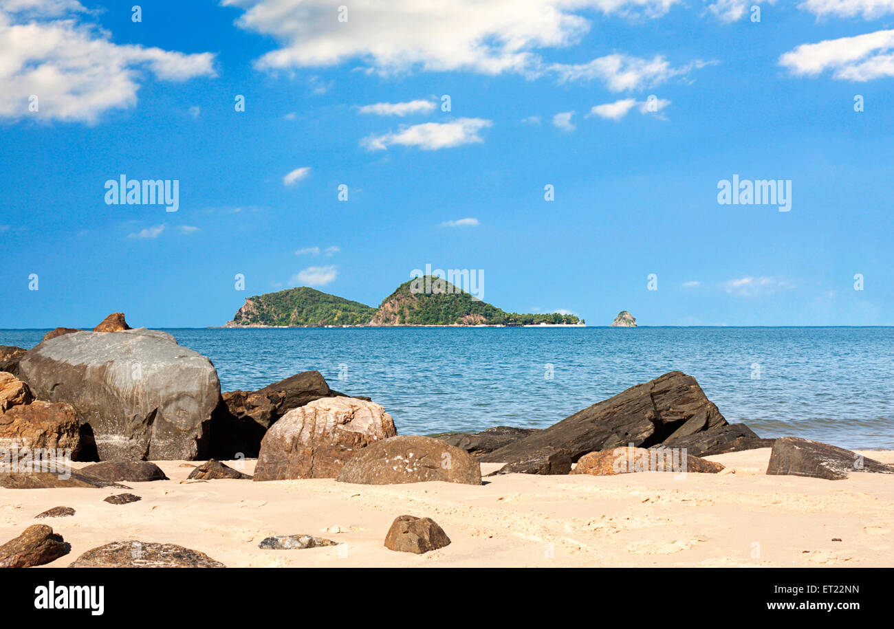 rocks in the foreground and a view to Double Island Stock Photo - Alamy