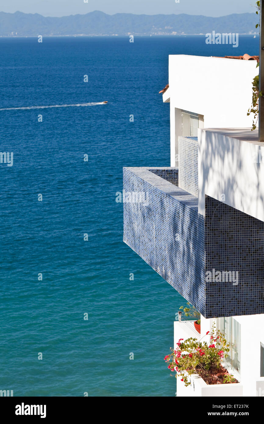 Balcony decorated with blue tiles over the ocean. Selective focus on ...