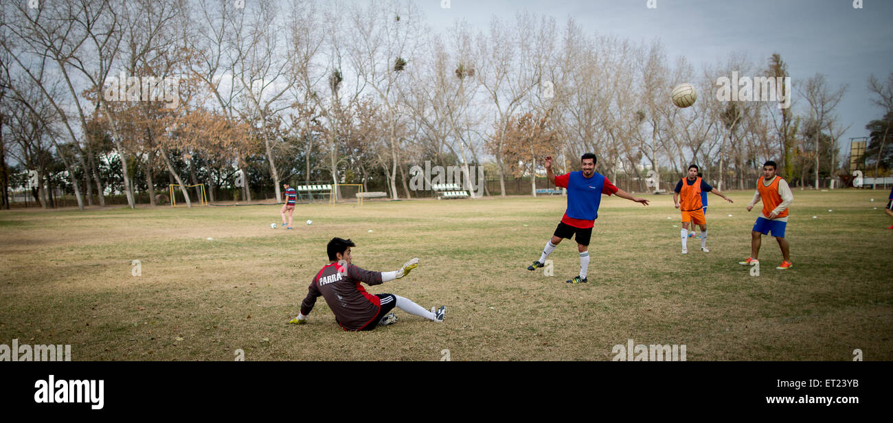 Santiago, Chile. 10th June, 2015. Students play soccer in a field ...