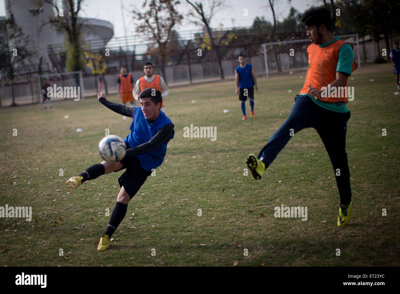 Santiago, Chile. 10th June, 2015. Students play soccer in a field ...