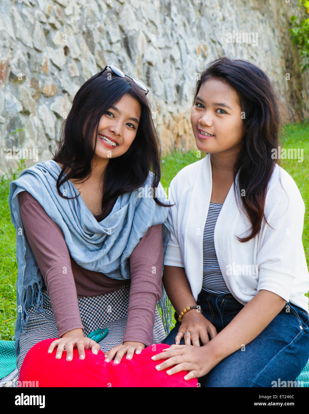 Two asian girl smiling and happy outdoor in the park Stock Photo - Alamy