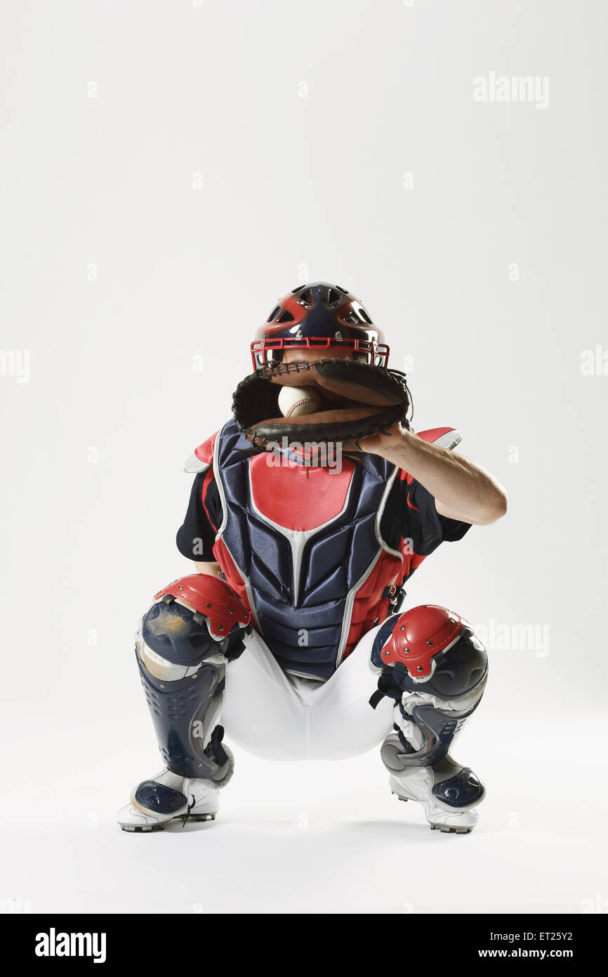 Baseball catcher against white background Stock Photo - Alamy
