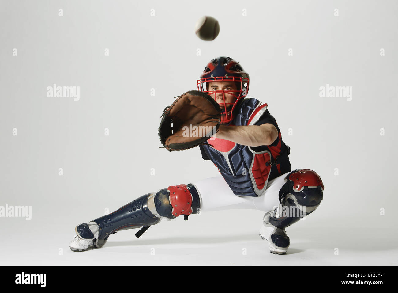 Baseball catcher against white background Stock Photo - Alamy
