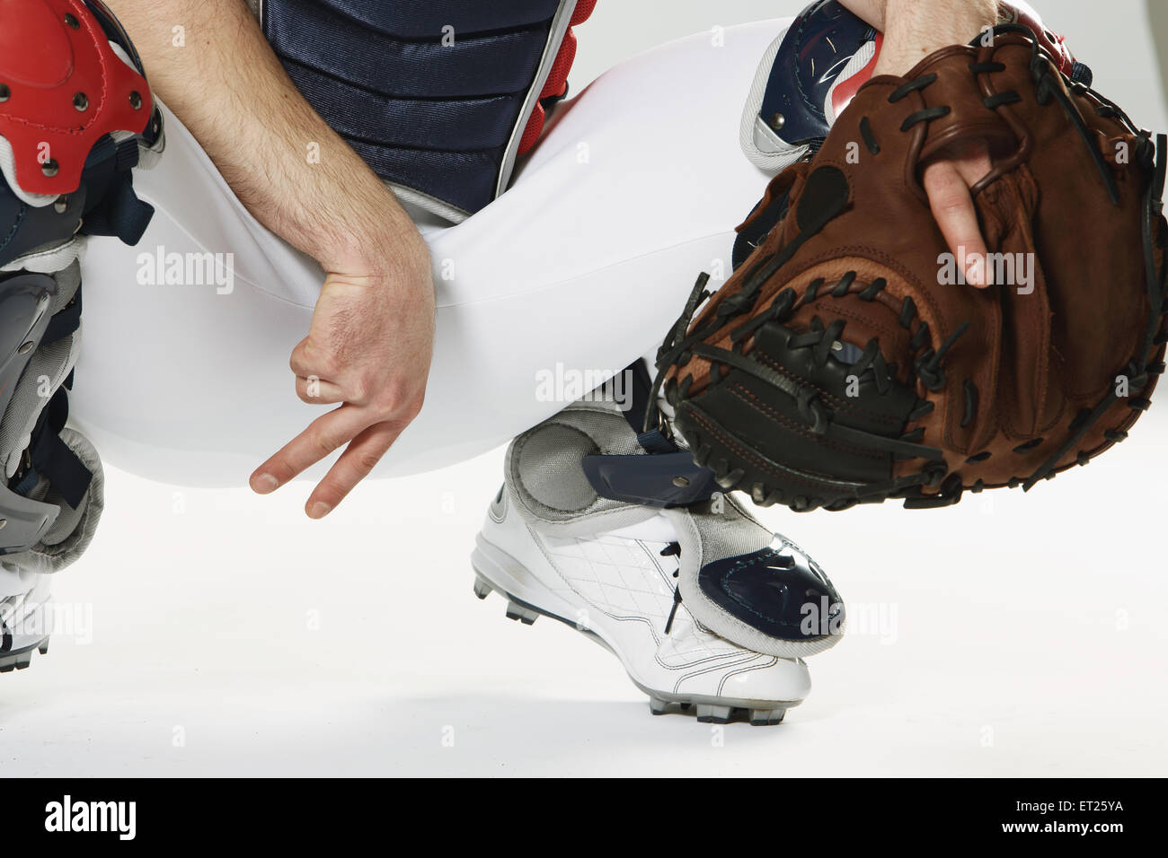 Baseball catcher against white background Stock Photo - Alamy