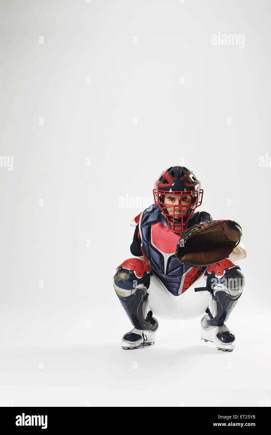 Baseball catcher against white background Stock Photo - Alamy