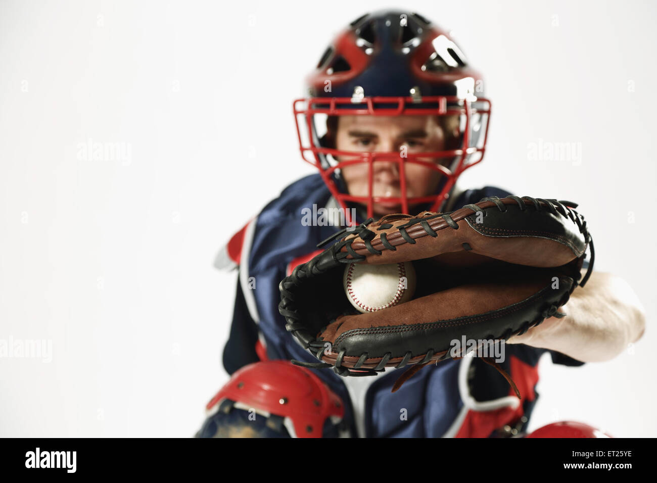 Baseball catcher against white background Stock Photo - Alamy