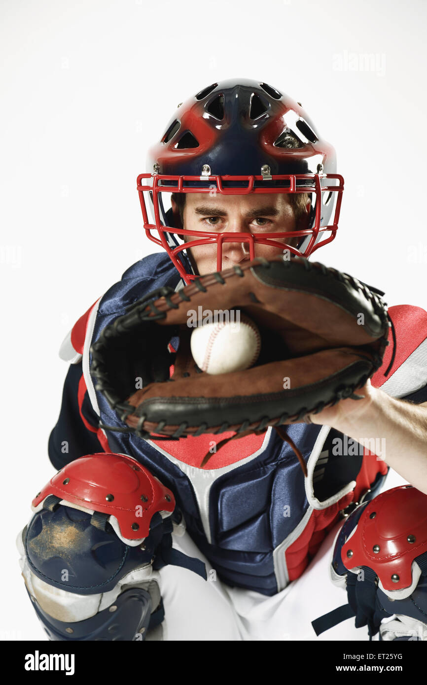 Baseball catcher against white background Stock Photo - Alamy