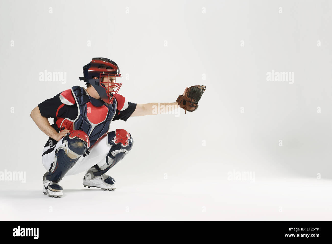 Baseball catcher against white background Stock Photo - Alamy