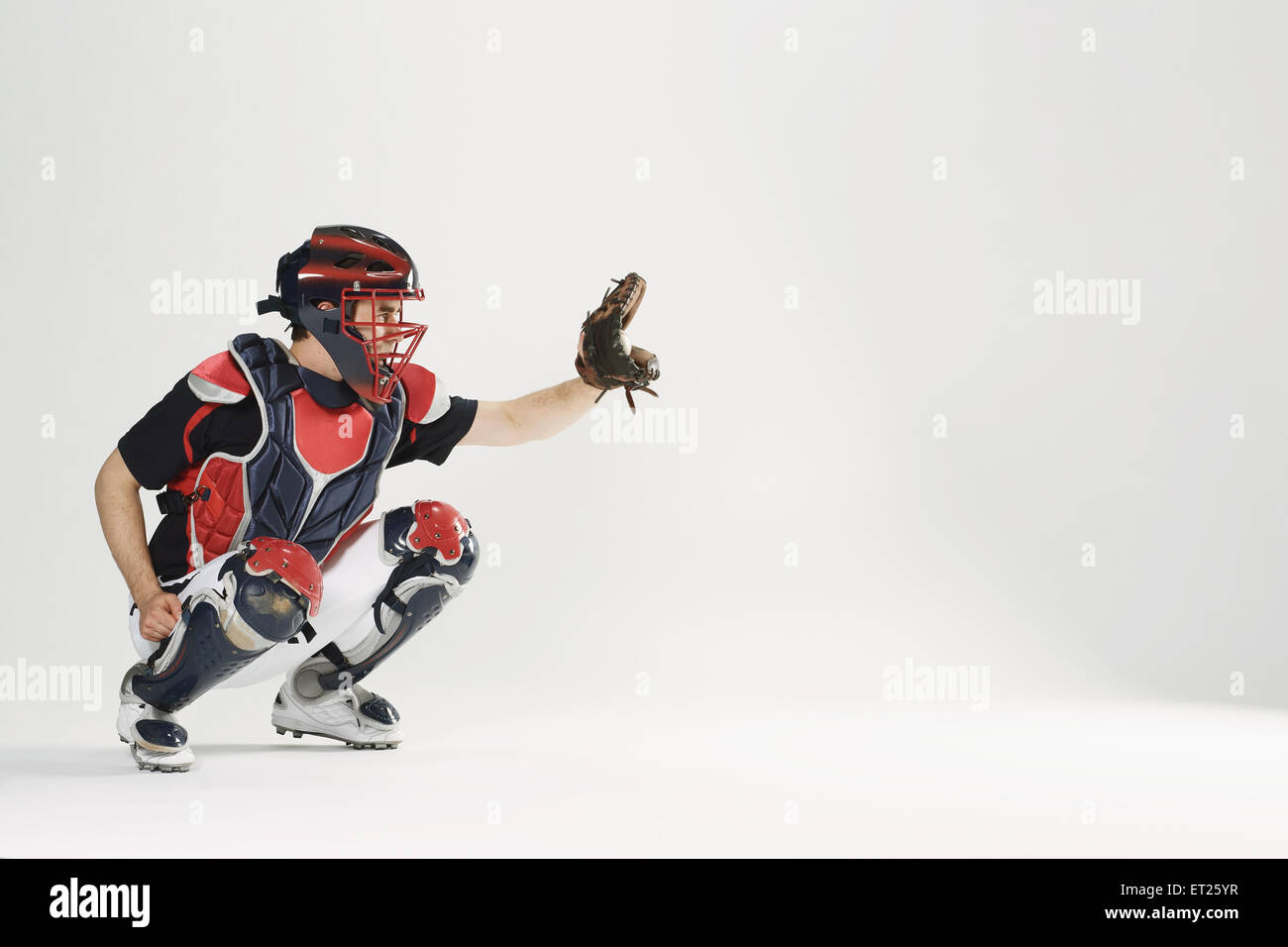 Baseball catcher against white background Stock Photo - Alamy