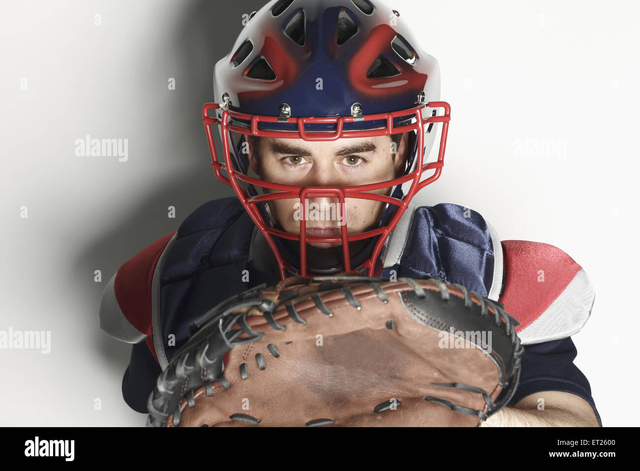 Baseball catcher against white background Stock Photo - Alamy