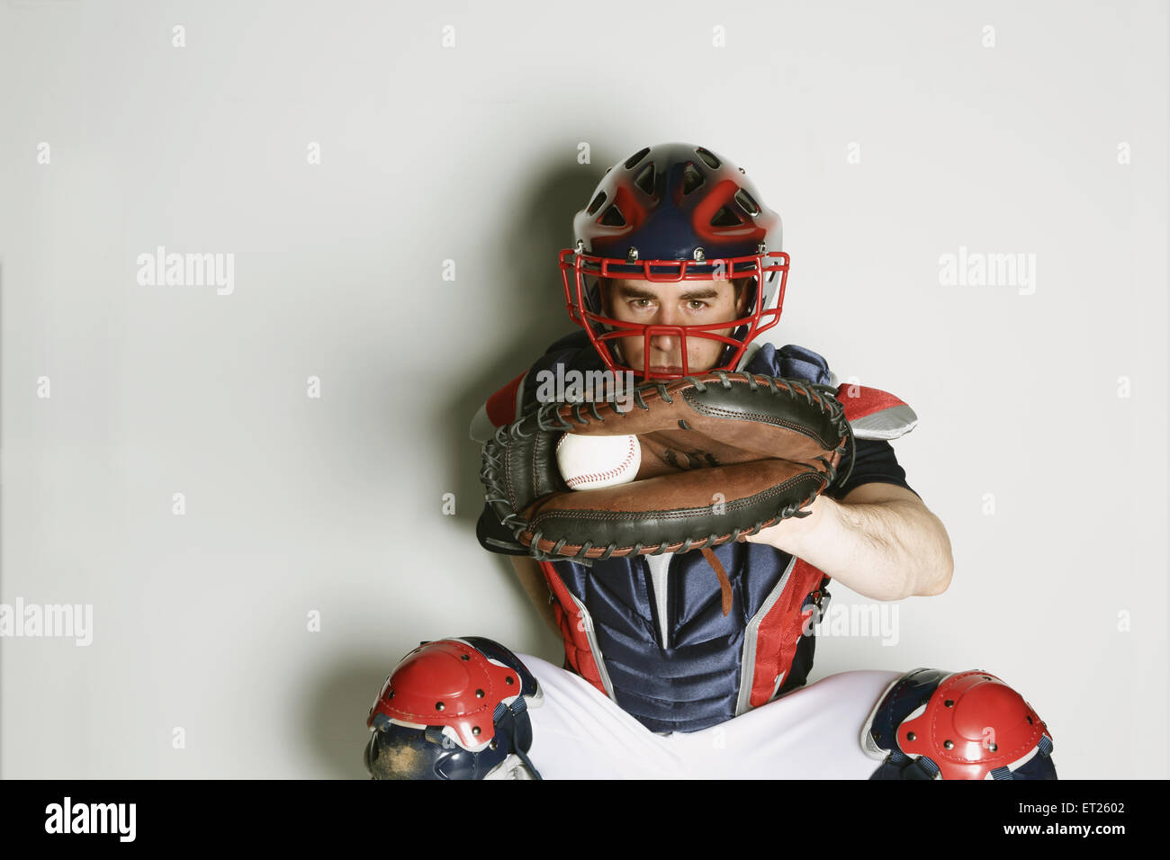 Baseball catcher against white background Stock Photo - Alamy