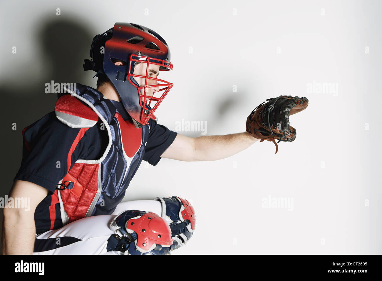 Baseball catcher against white background Stock Photo - Alamy