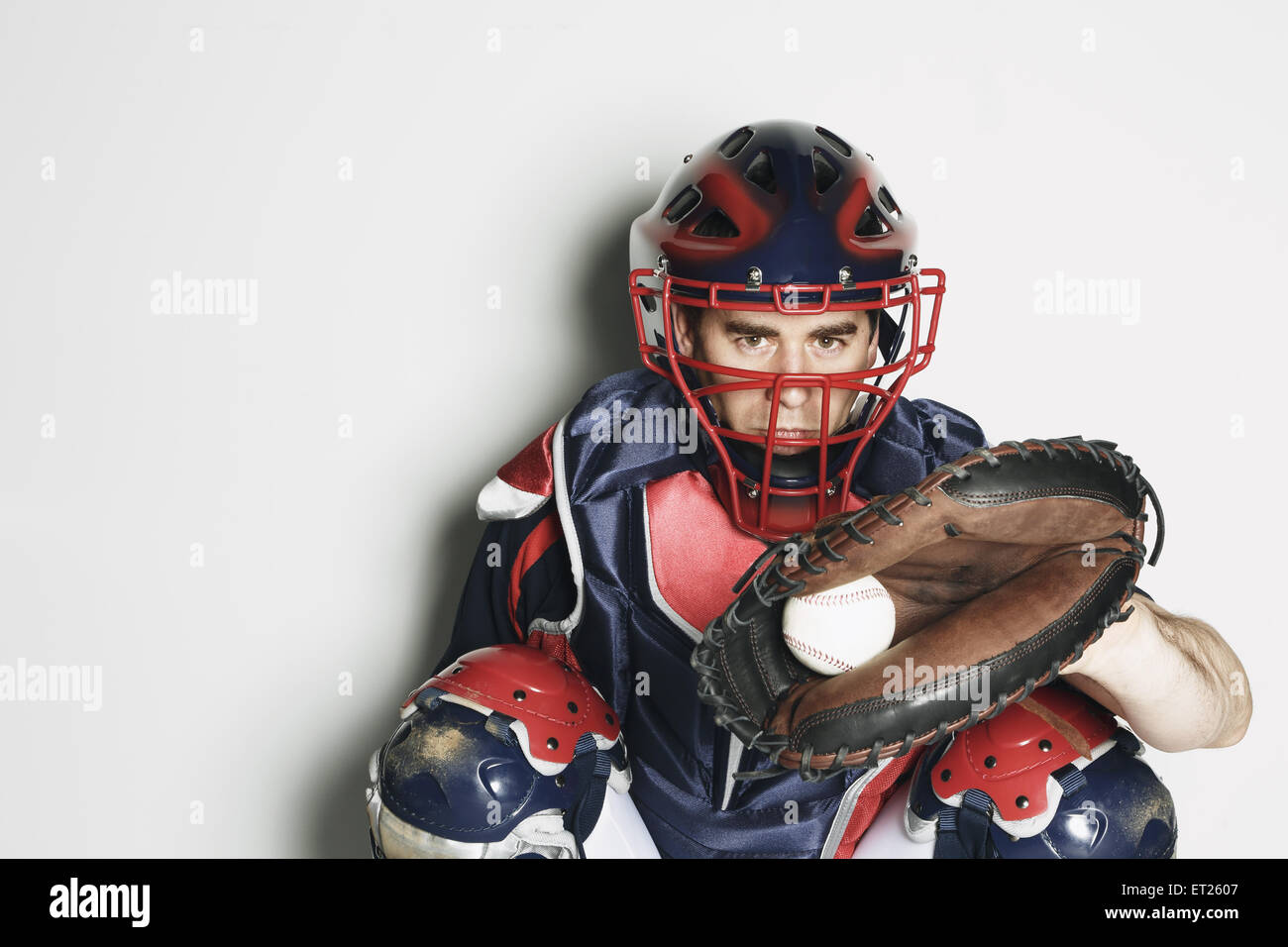Baseball catcher against white background Stock Photo - Alamy