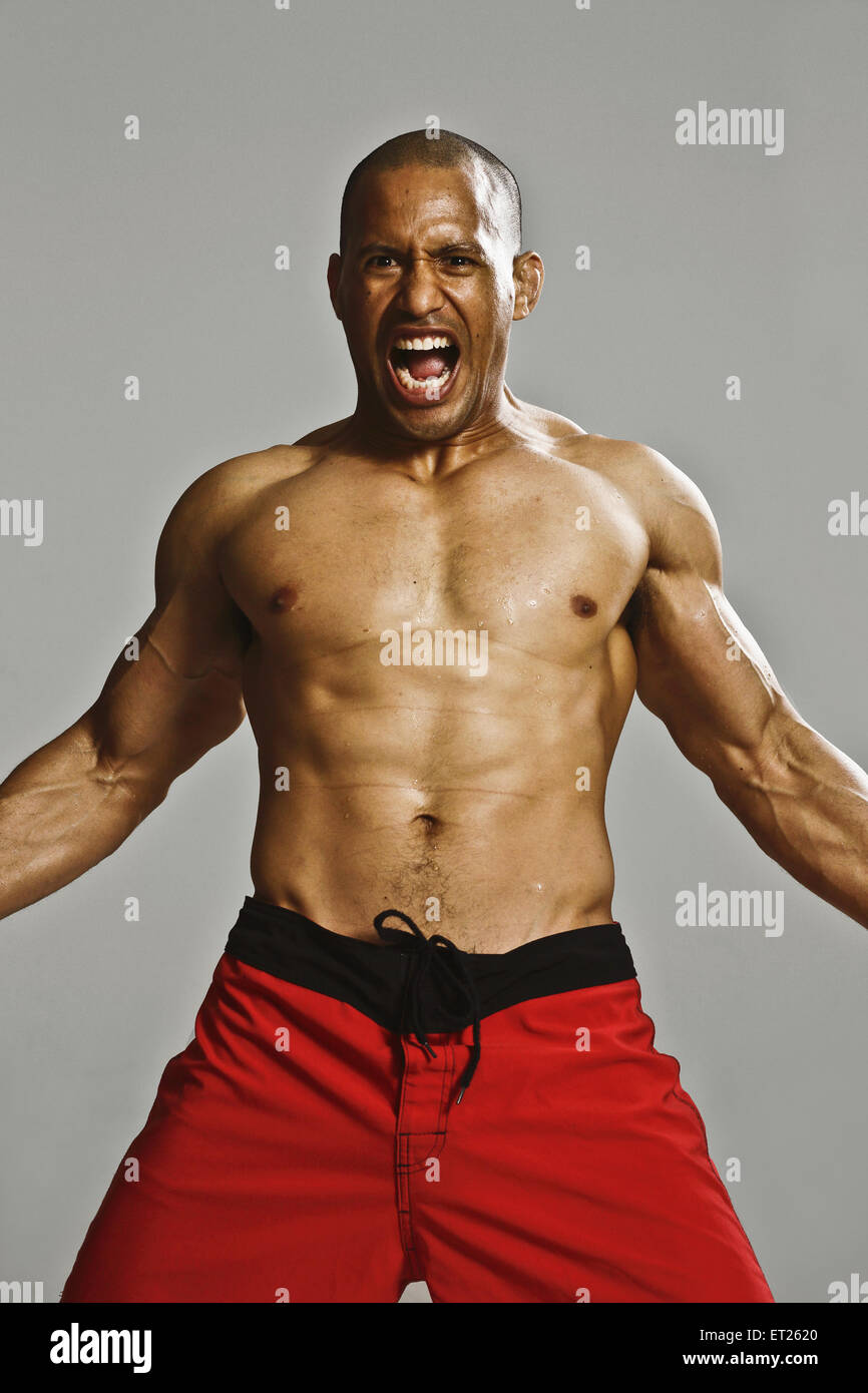 Bald male athlete in a fighting pose Stock Photo - Alamy