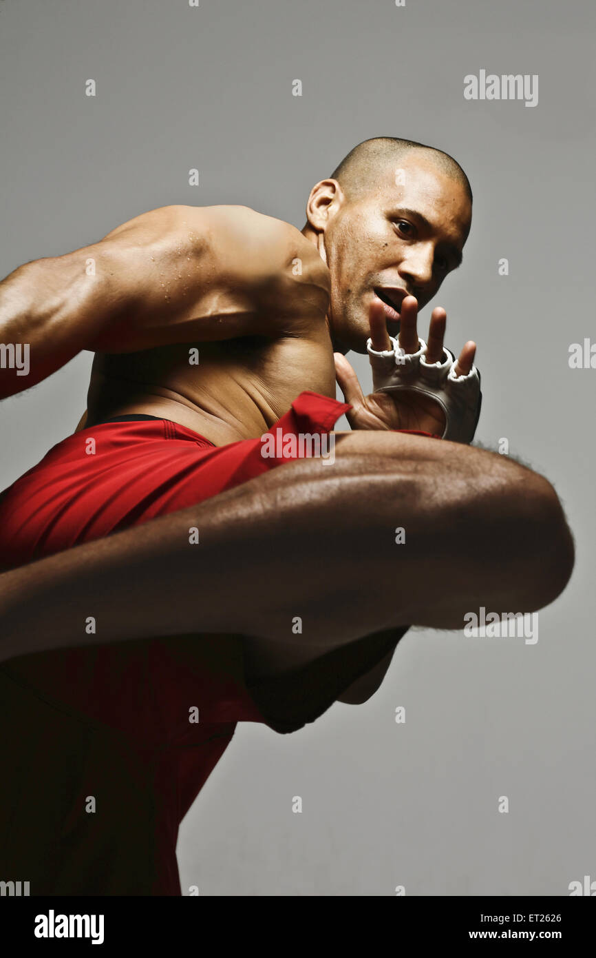Bald male athlete in a fighting pose Stock Photo - Alamy