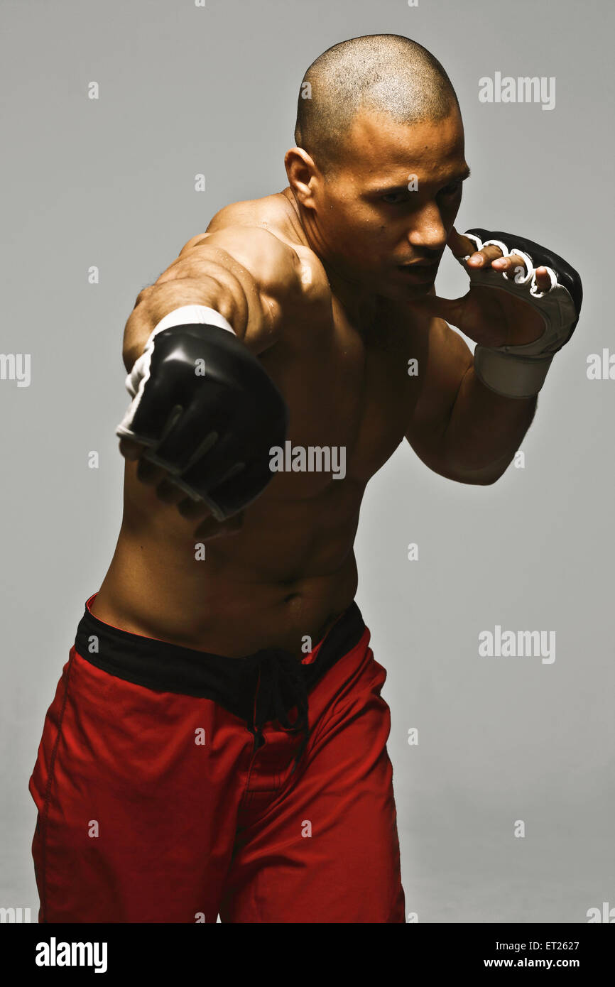 Bald male athlete in a fighting pose Stock Photo - Alamy