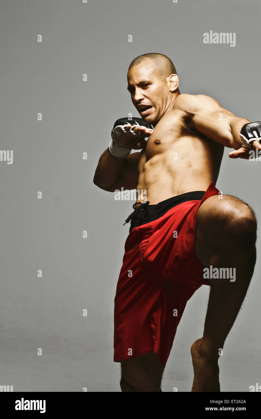 Bald male athlete in a fighting pose Stock Photo - Alamy