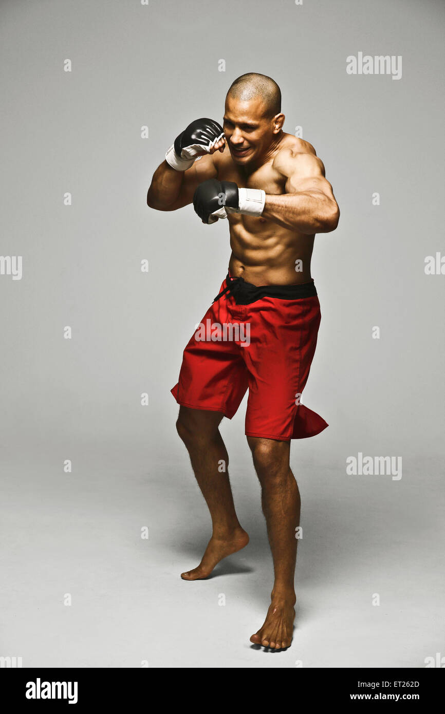 Bald male athlete in a fighting pose Stock Photo - Alamy