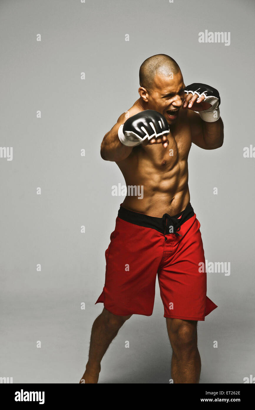 Bald male athlete in a fighting pose Stock Photo - Alamy