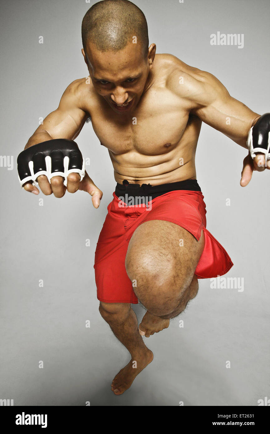 Bald male athlete in a fighting pose Stock Photo - Alamy