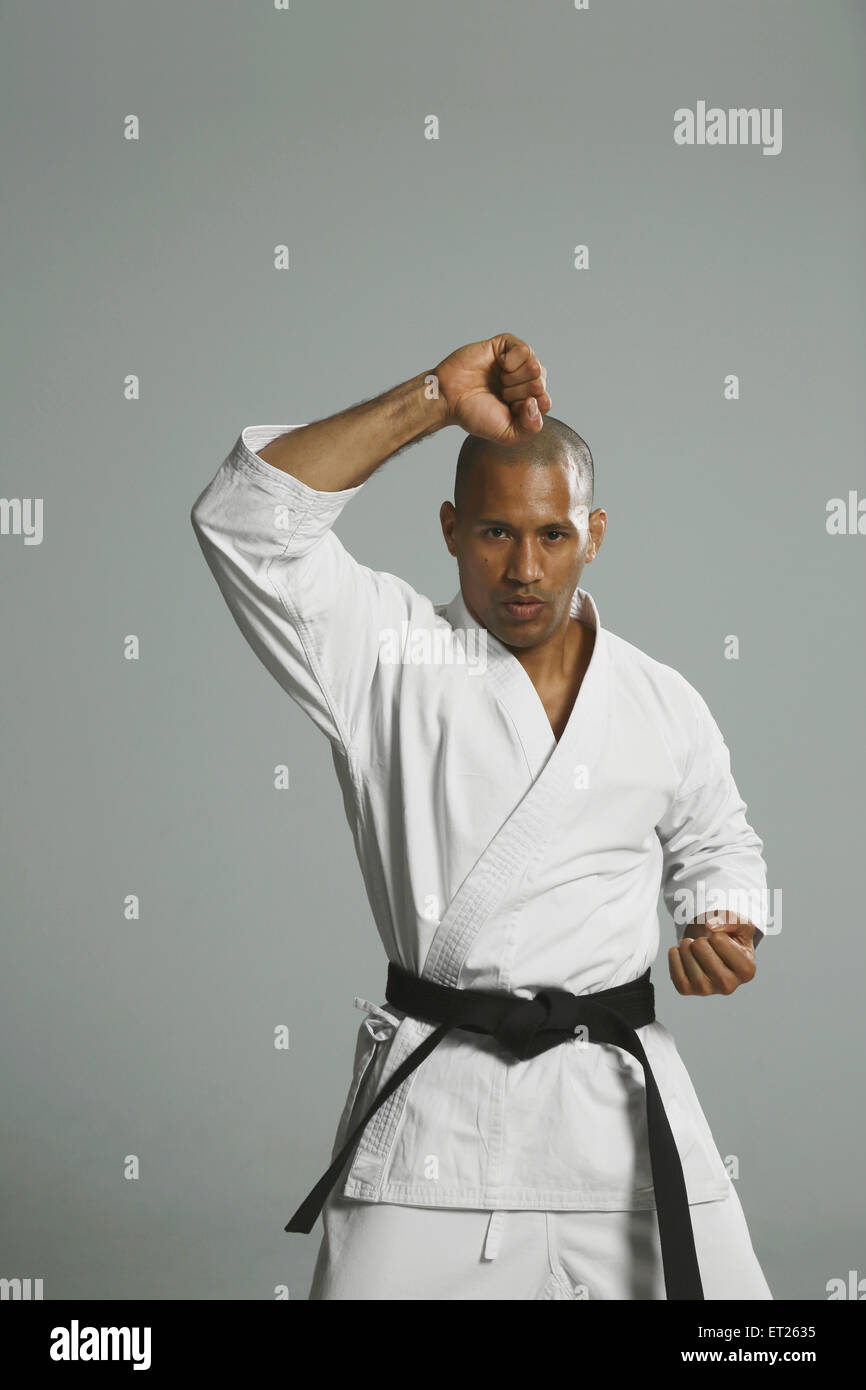 Bald male athlete in a fighting pose Stock Photo - Alamy