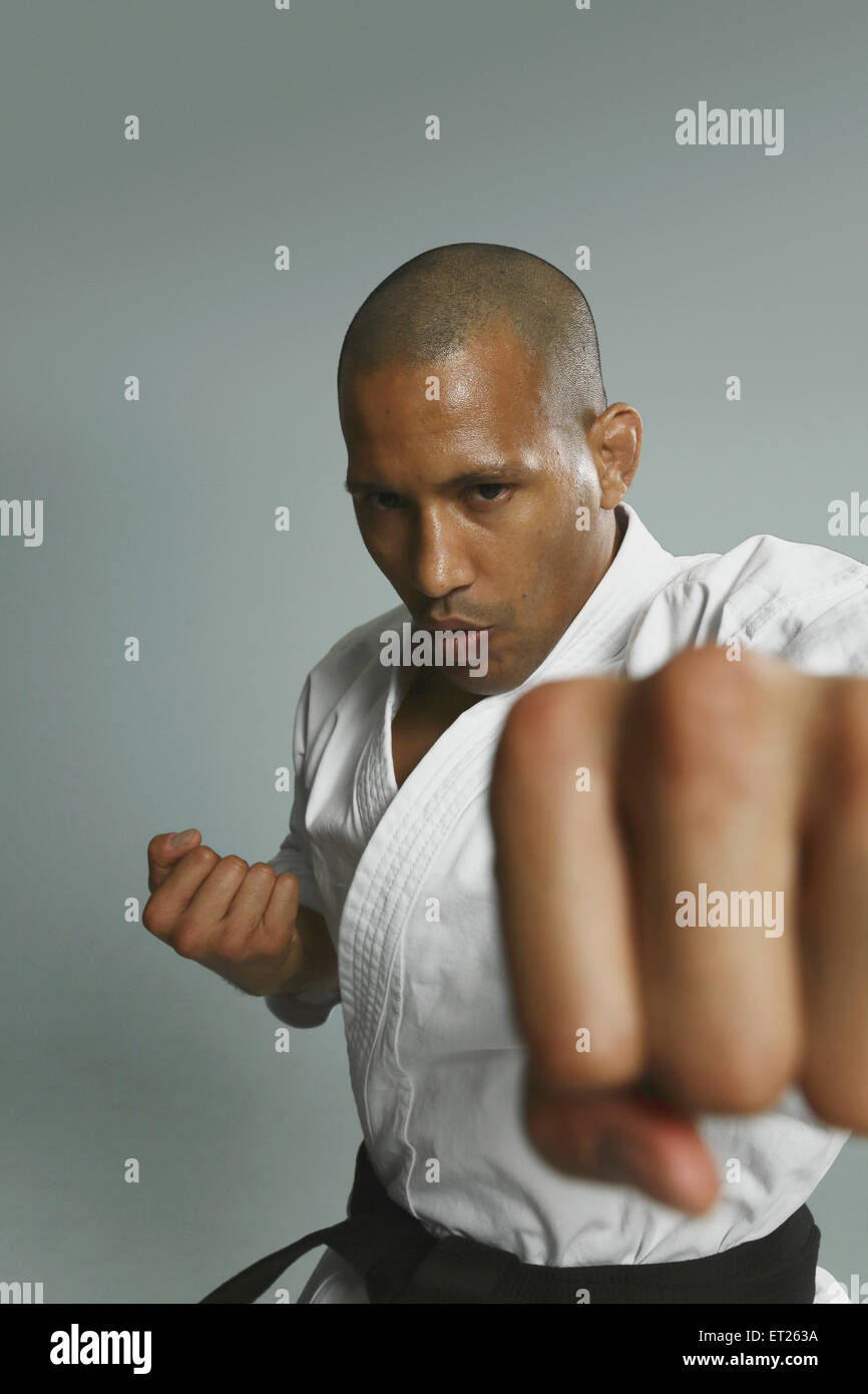 Bald male athlete in a fighting pose Stock Photo - Alamy