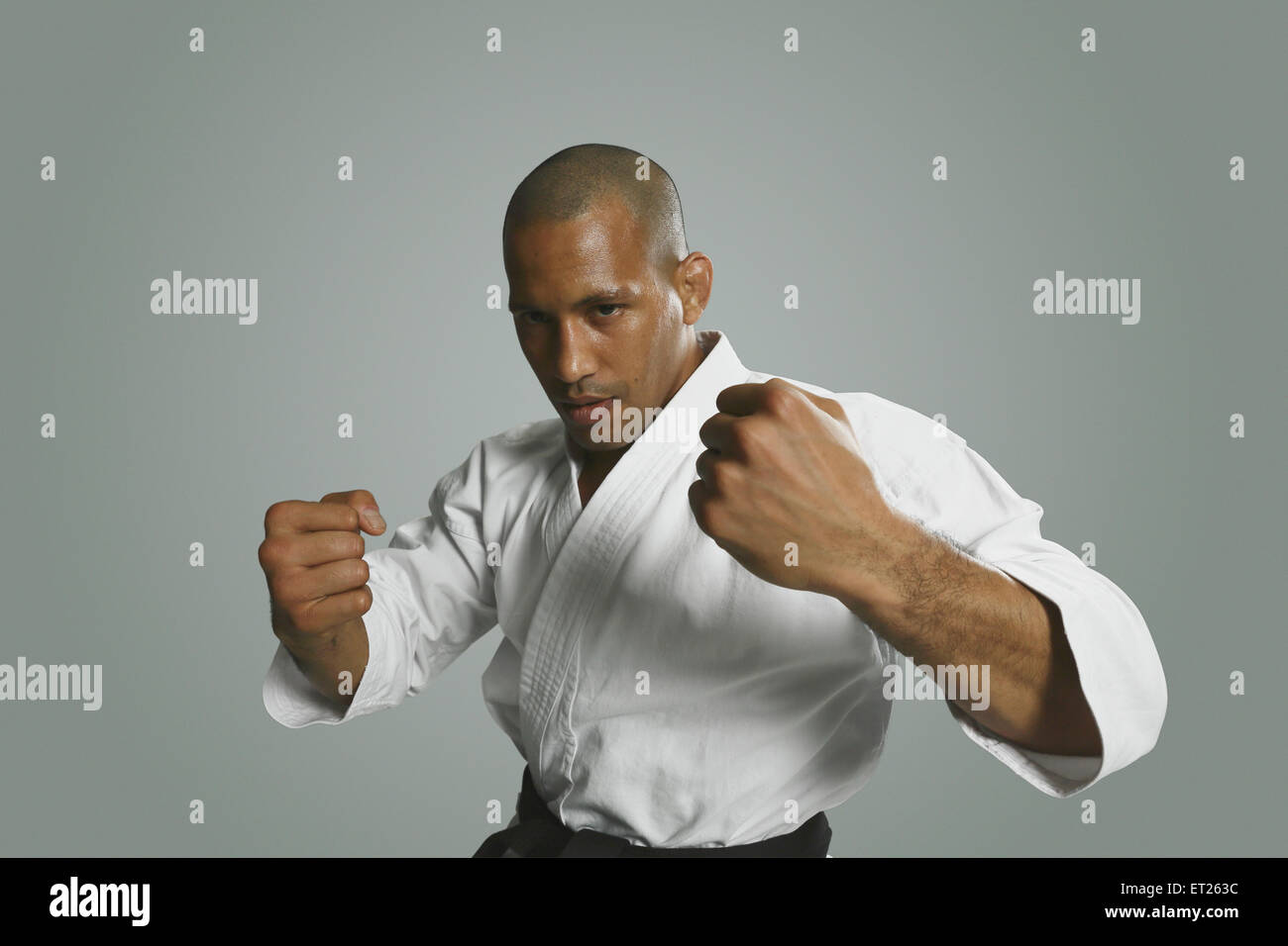 Bald male athlete in a fighting pose Stock Photo - Alamy