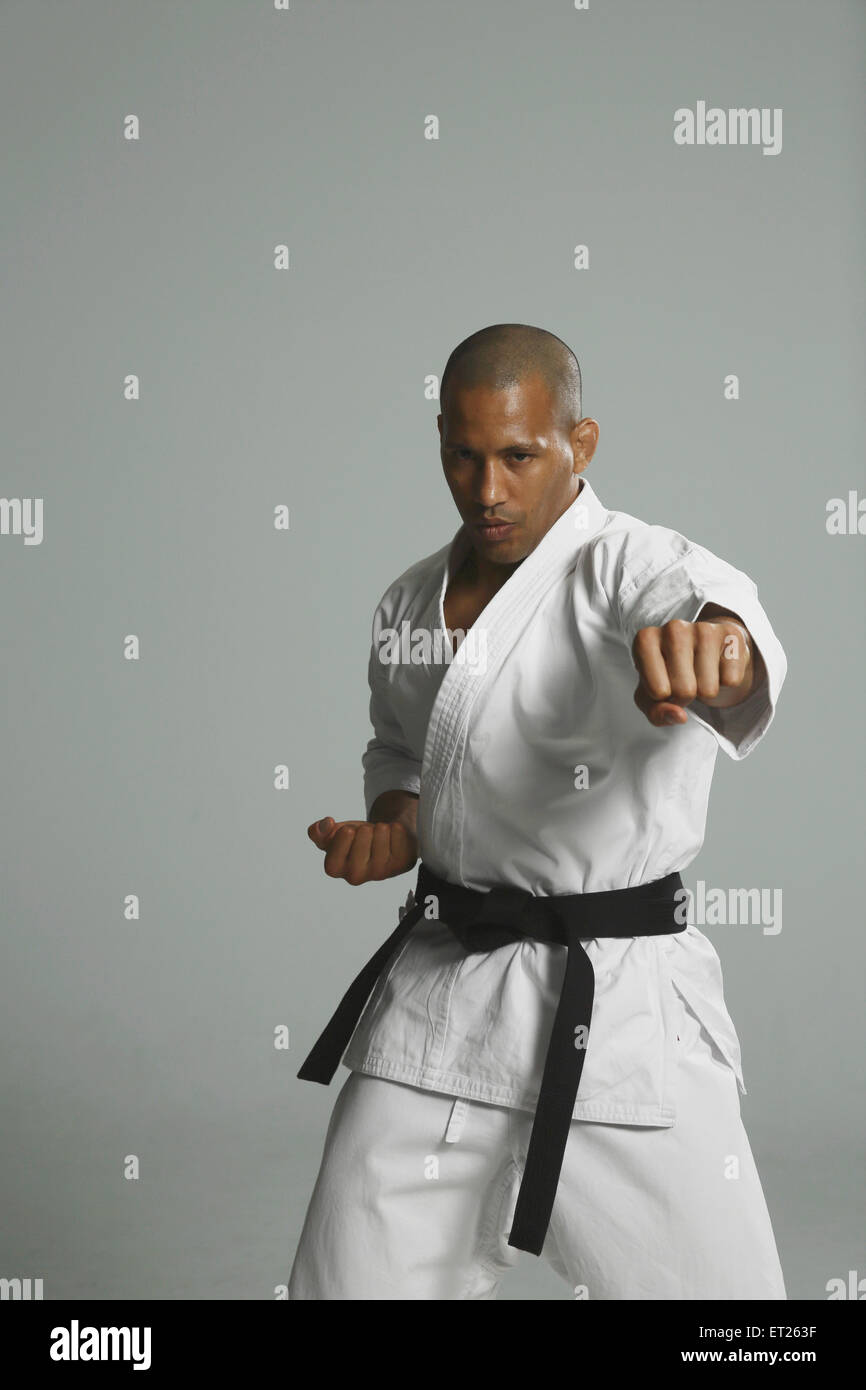 Bald male athlete in a fighting pose Stock Photo - Alamy