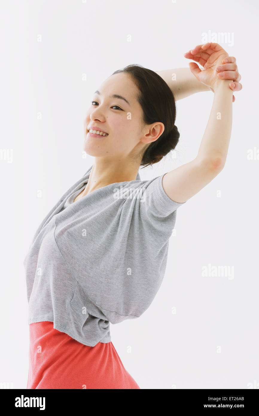 Woman raising arms side view hi-res stock photography and images - Alamy