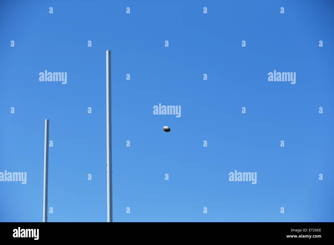 Rugby ball flying through goal Stock Photo - Alamy