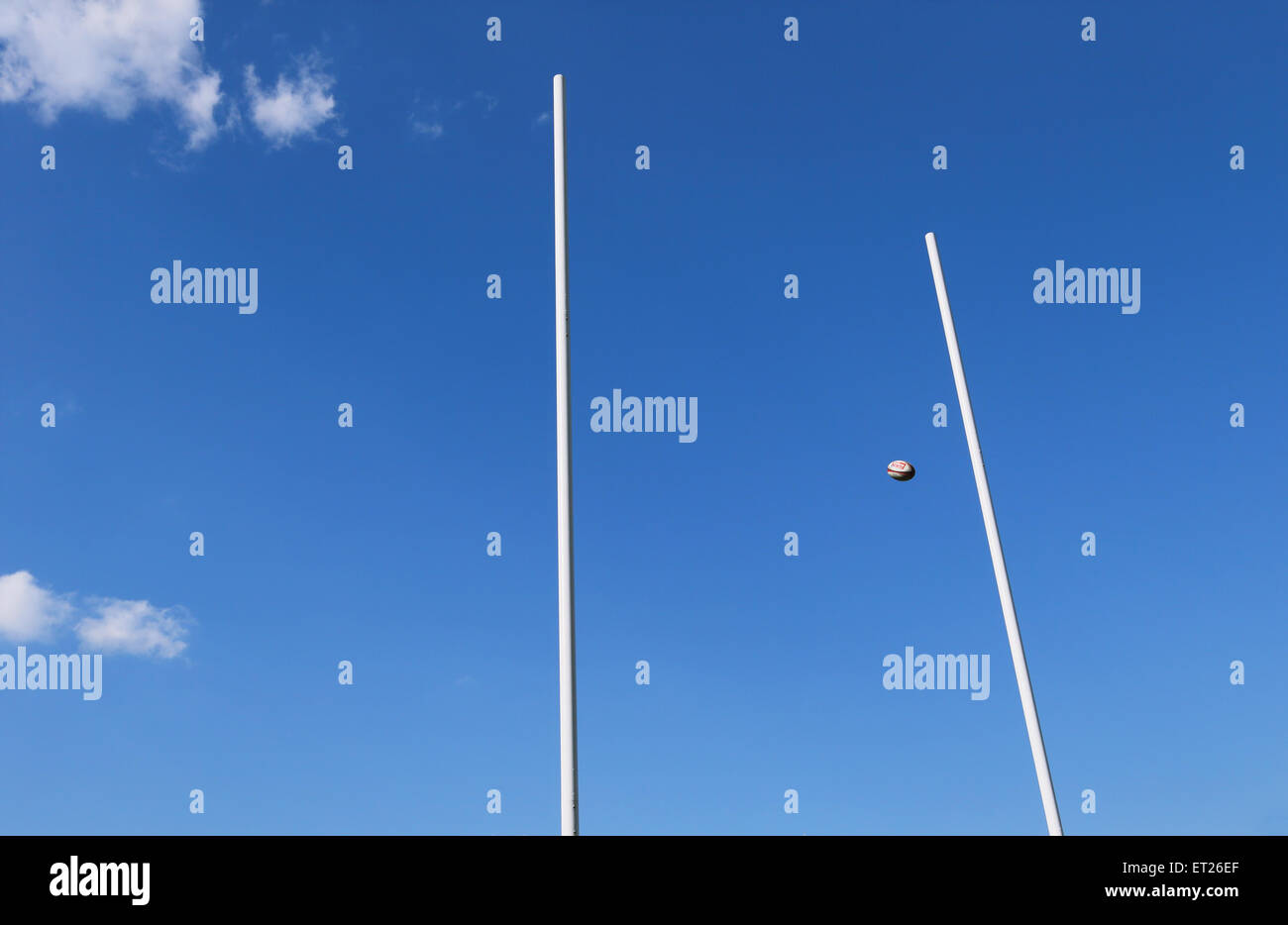 Rugby ball flying through goal Stock Photo - Alamy