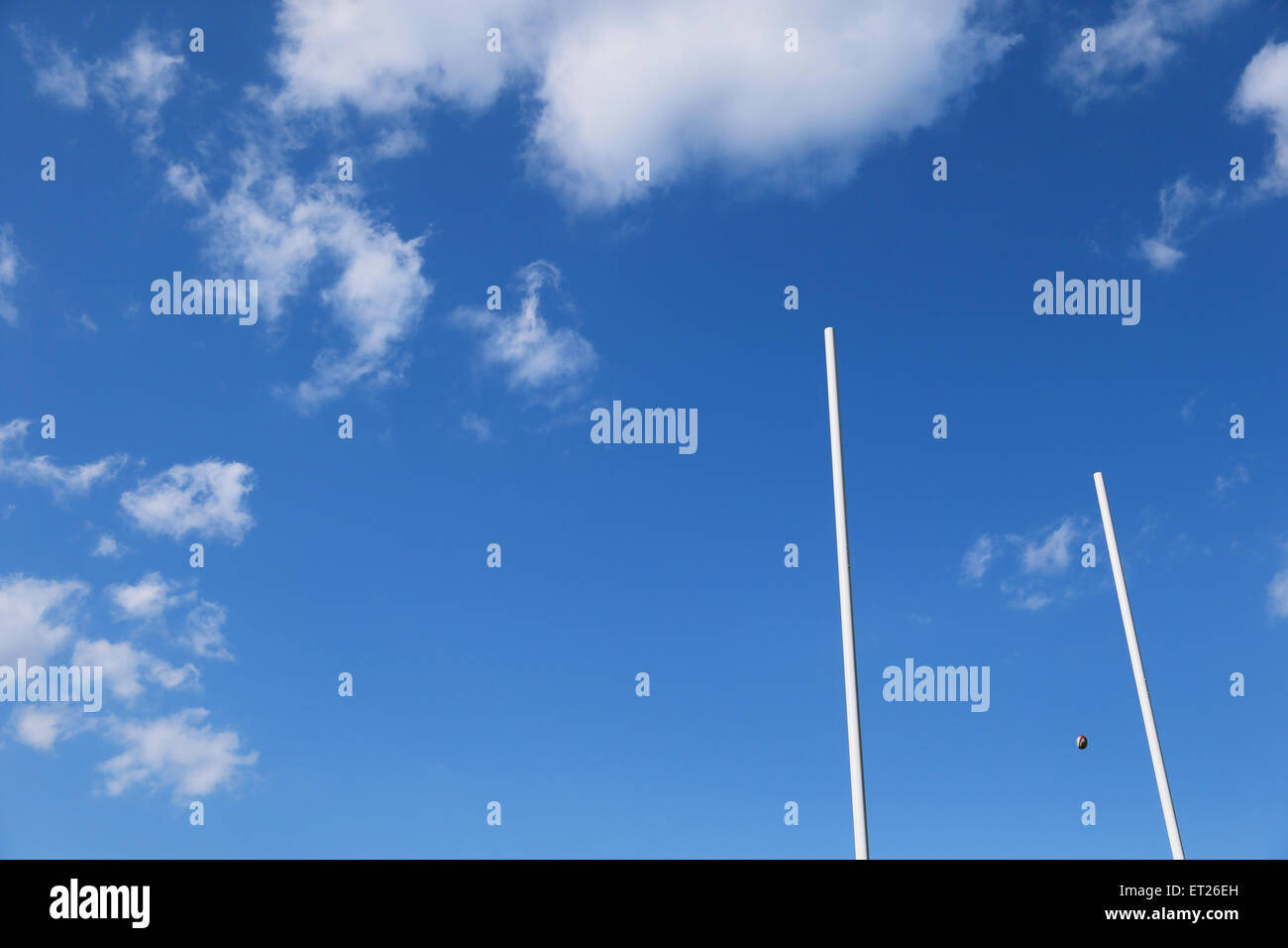 Rugby ball flying through goal Stock Photo - Alamy