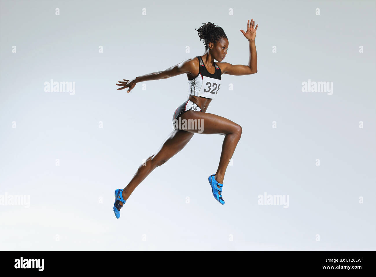 Female Athlete Running Stock Photo - Alamy